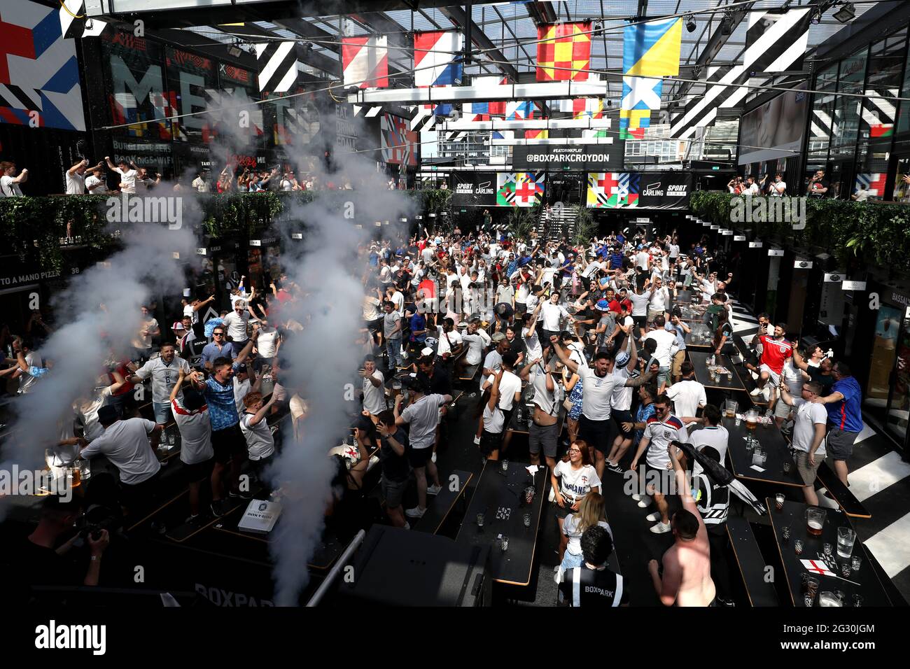 Fans celebrate after the match at BOXPARK in Croydon as they watch the ...
