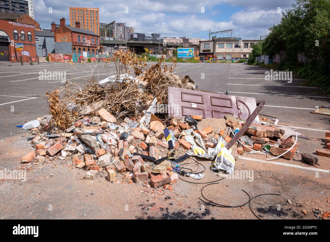 Fly tipping in a carpark, Digbeth, Birmingham, UK Stock Photo - Alamy