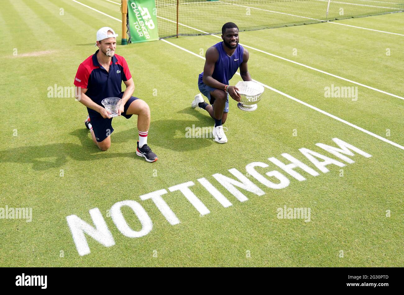 Winner Frances Tiafoe and runner up Denis Kudla with their trophies ...
