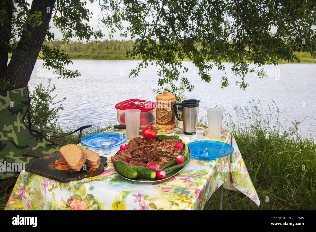 Still life outdoor with barbecue and bouquet wildflowers Stock Photo ...