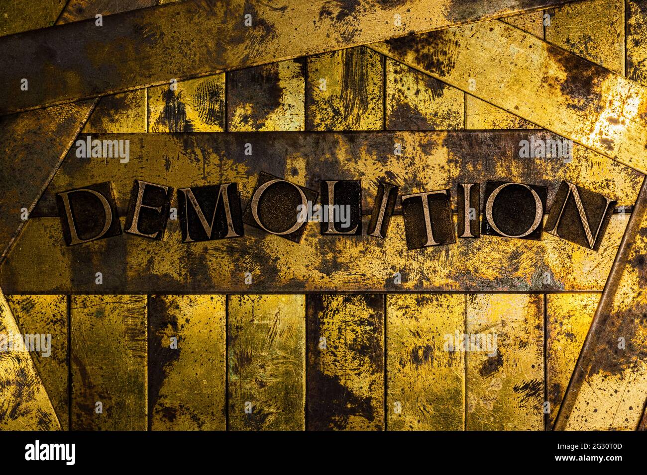 Demolition text on vintage textured grunge copper and gold background ...