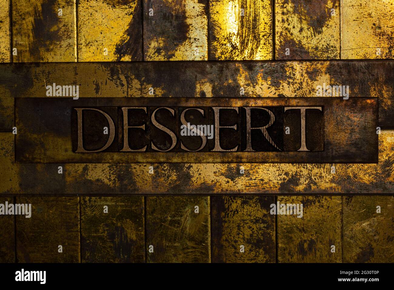 Dessert text on textured copper and gold background Stock Photo - Alamy