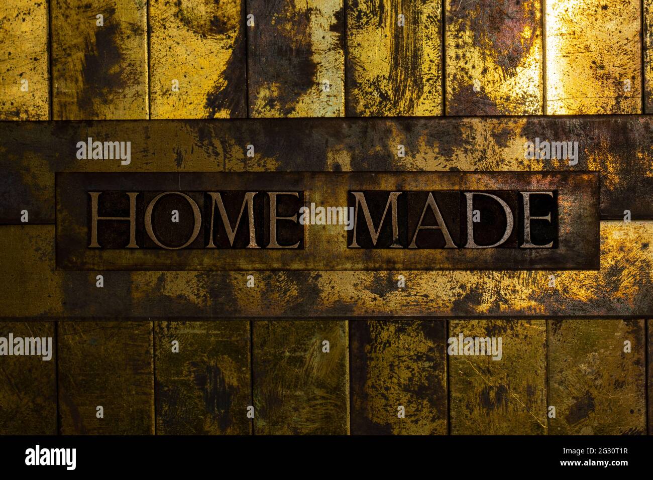 Home Made text on textured copper and gold background Stock Photo - Alamy