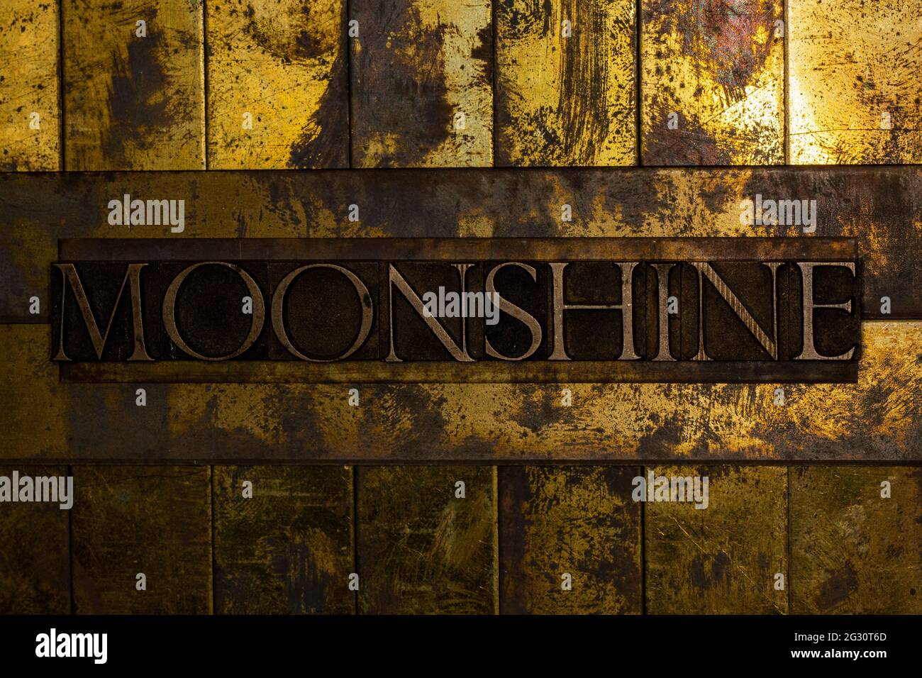Moonshine text on textured copper and gold background Stock Photo - Alamy