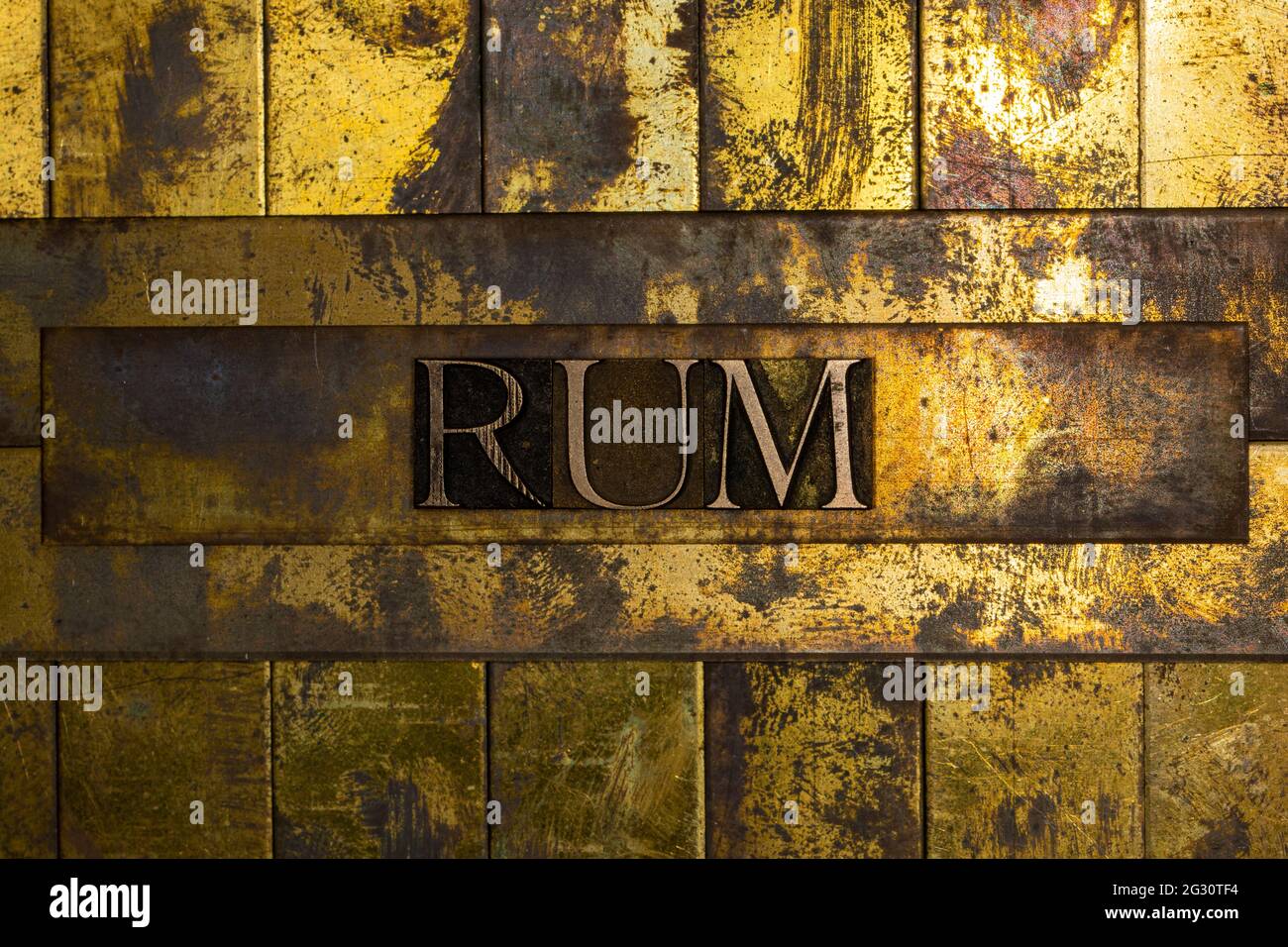 Rum text on textured copper and gold background Stock Photo - Alamy