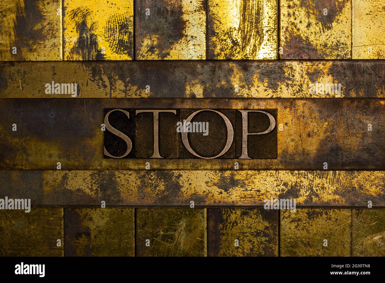 Stop text on vintage textured grunge copper and gold background Stock ...
