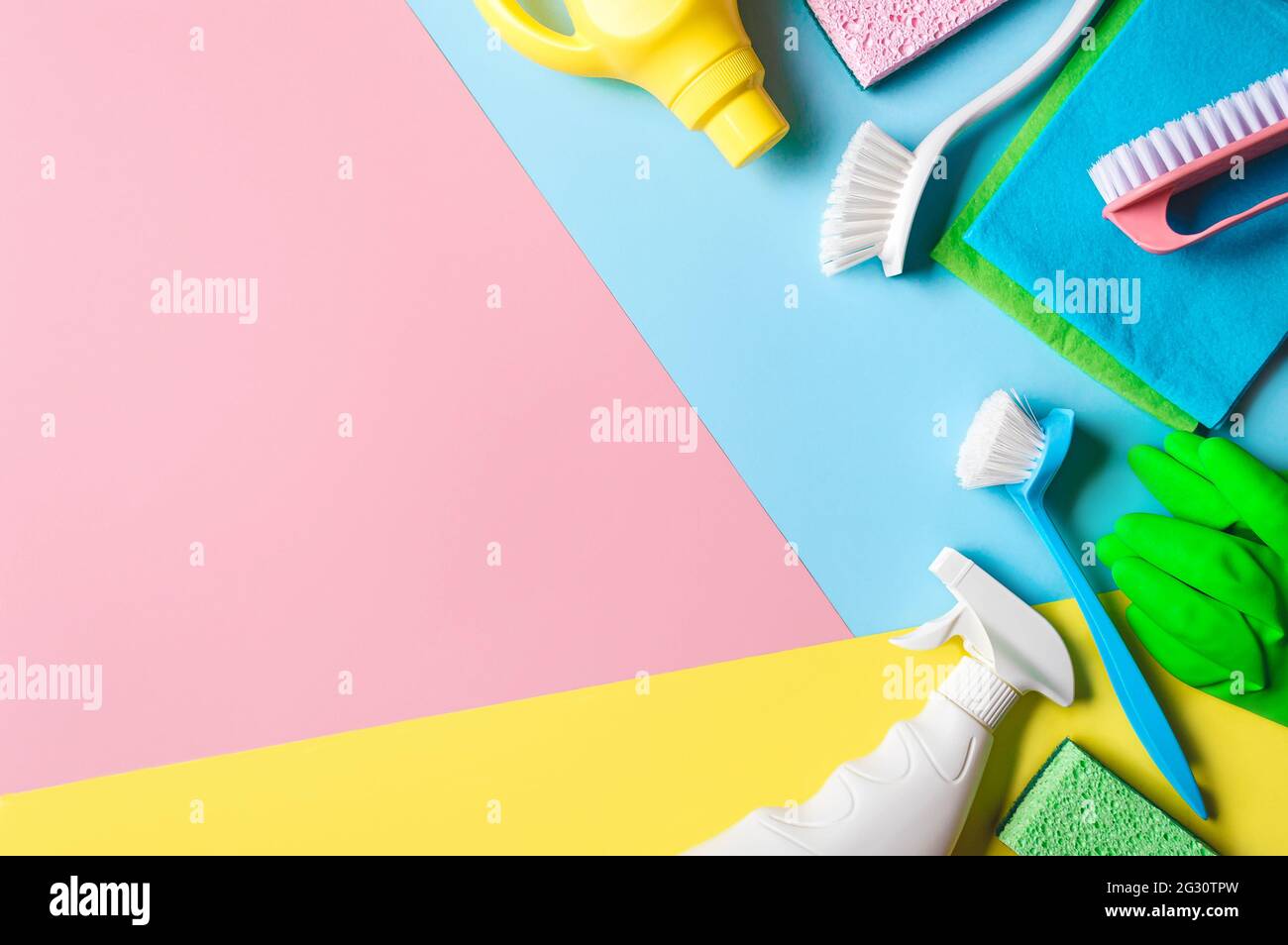 House cleaning product on pink background, copy space. Flat lay or top ...