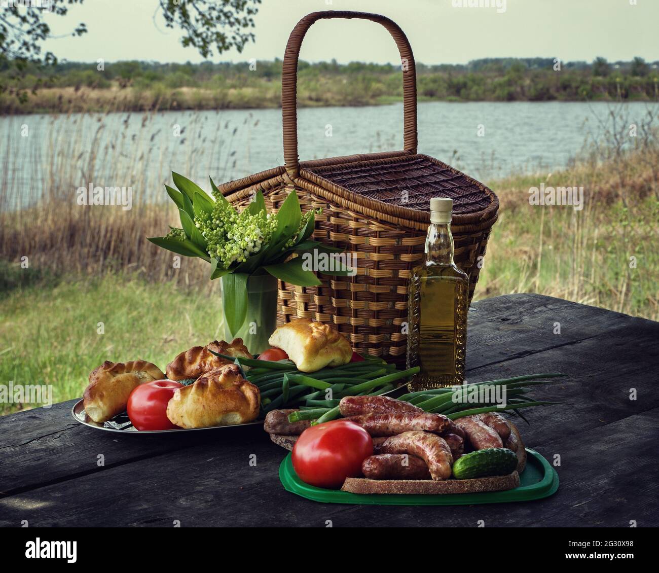 Still life outdoor with barbecue and bouquet wildflowers Stock Photo ...