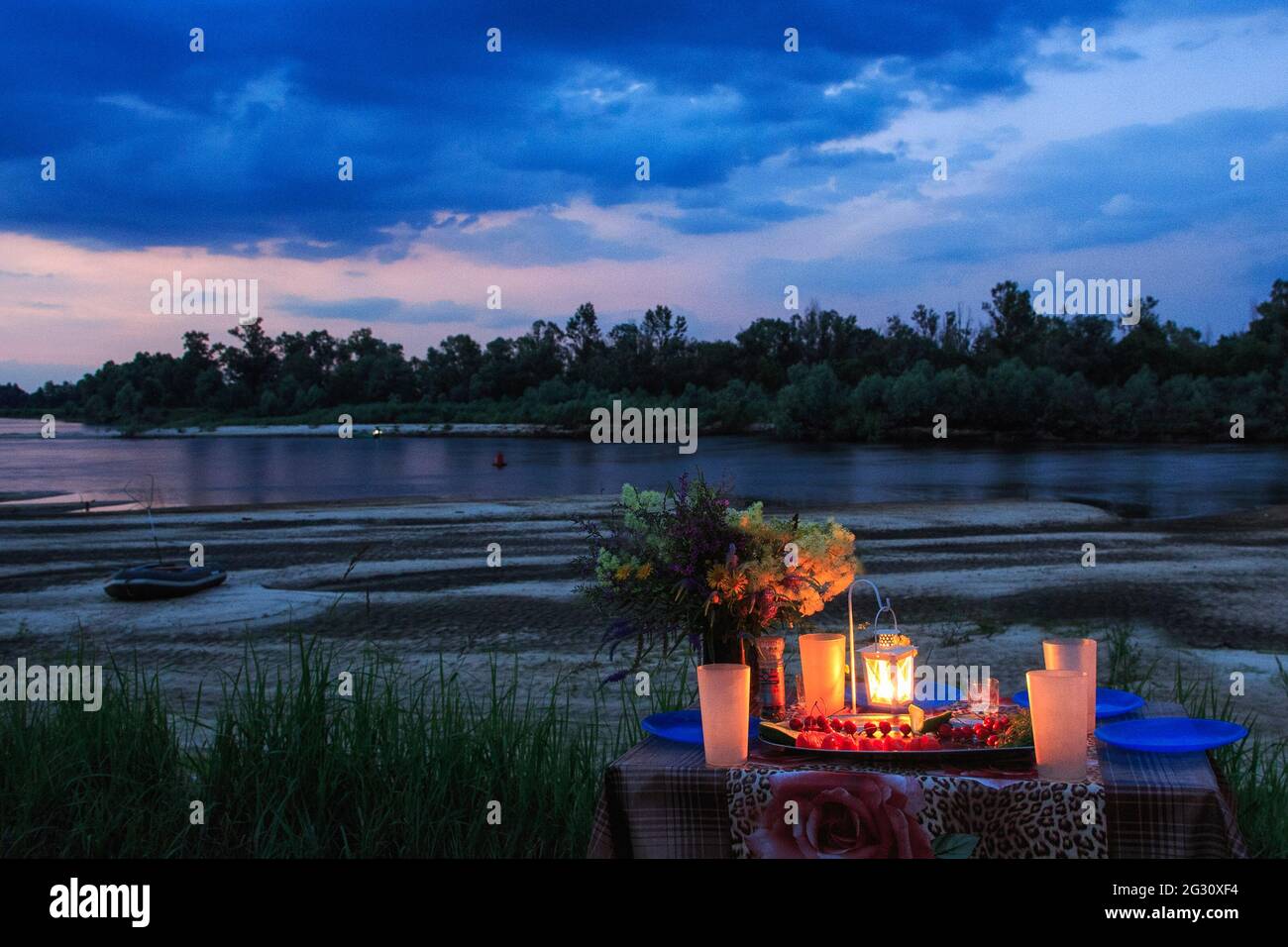 Still life outdoor with barbecue and bouquet wildflowers Stock Photo ...