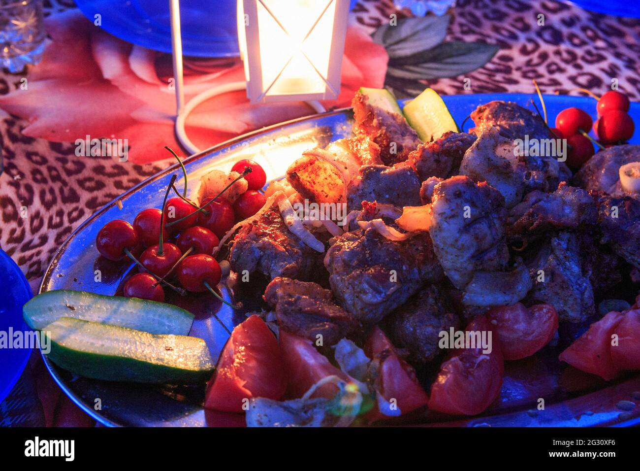 Still life outdoor with barbecue and bouquet wildflowers Stock Photo ...