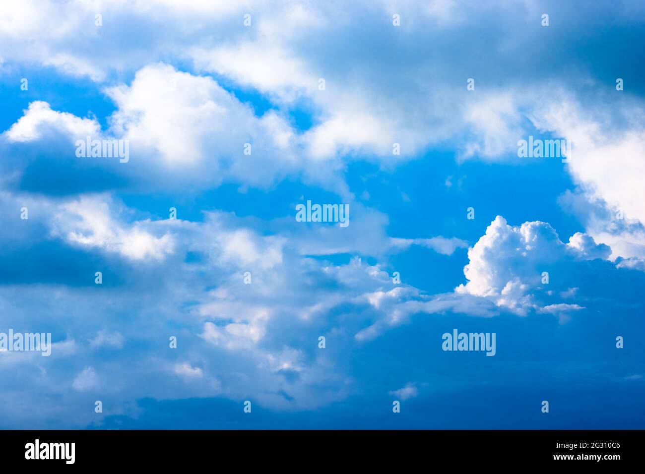 Fully blue sky with white clouds and sun reflection Stock Photo - Alamy