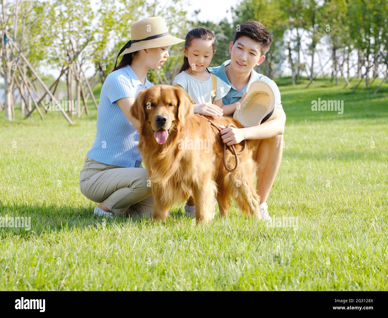 Happy family of three and pet dog in outdoor photo high quality photo ...