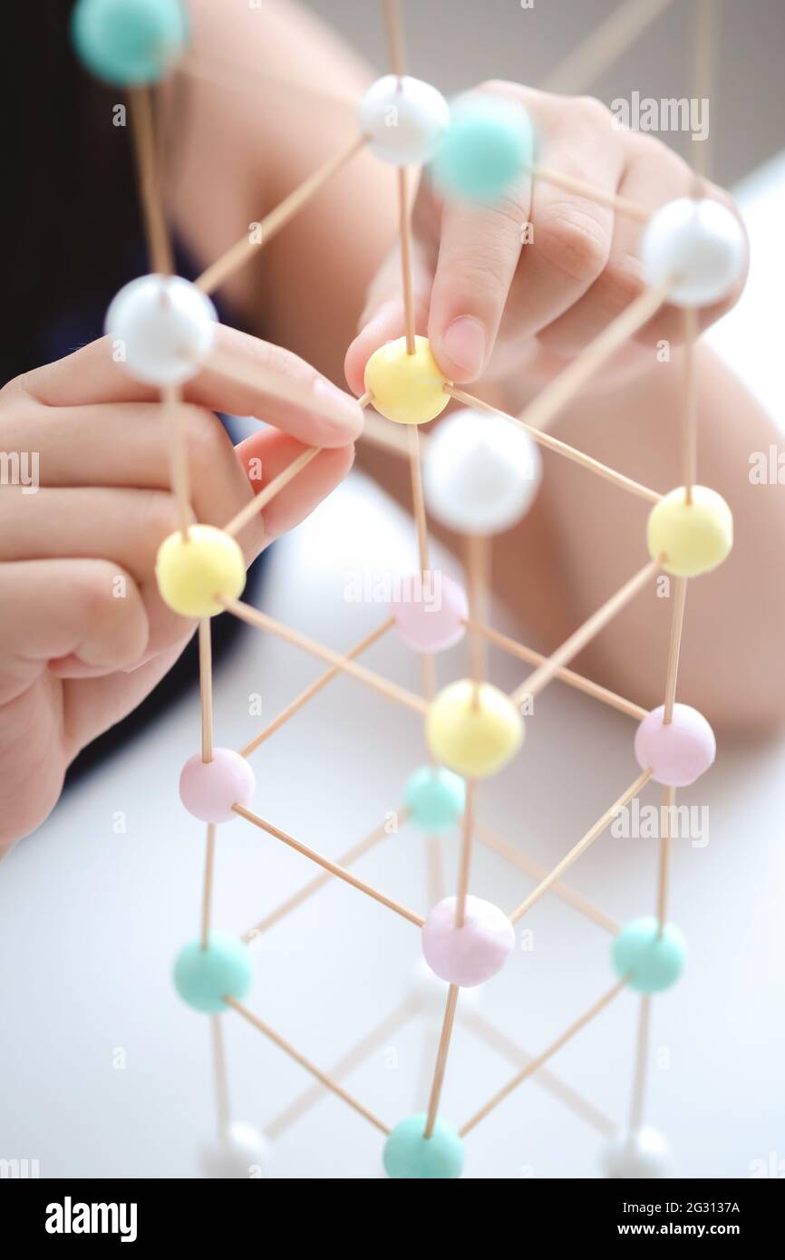 STEM education, Close up hands, child learning making 3D geometric ...