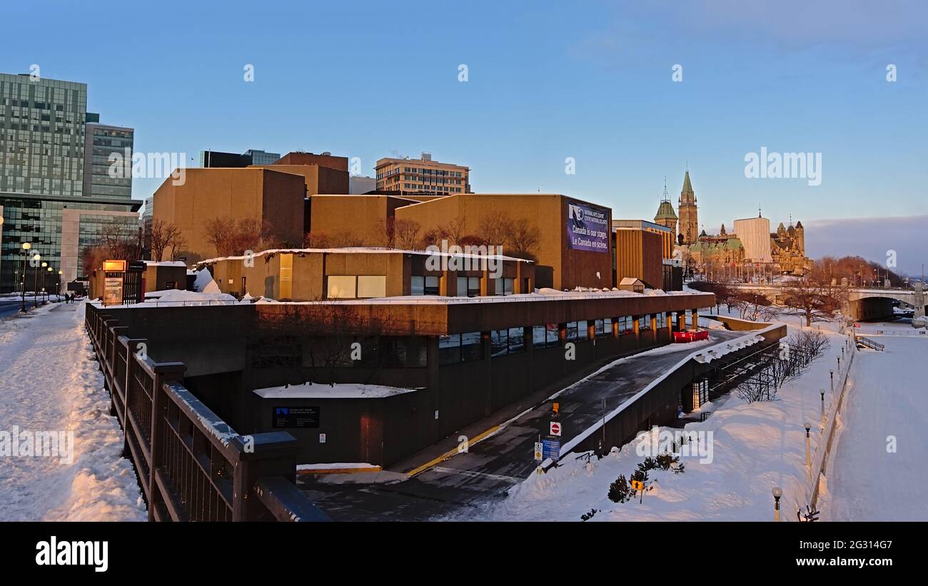 National arts centre along rideau canal, with parliament hill in the ...