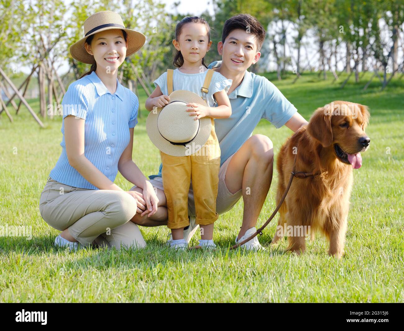 Happy family of three and pet dog in outdoor photo high quality photo ...