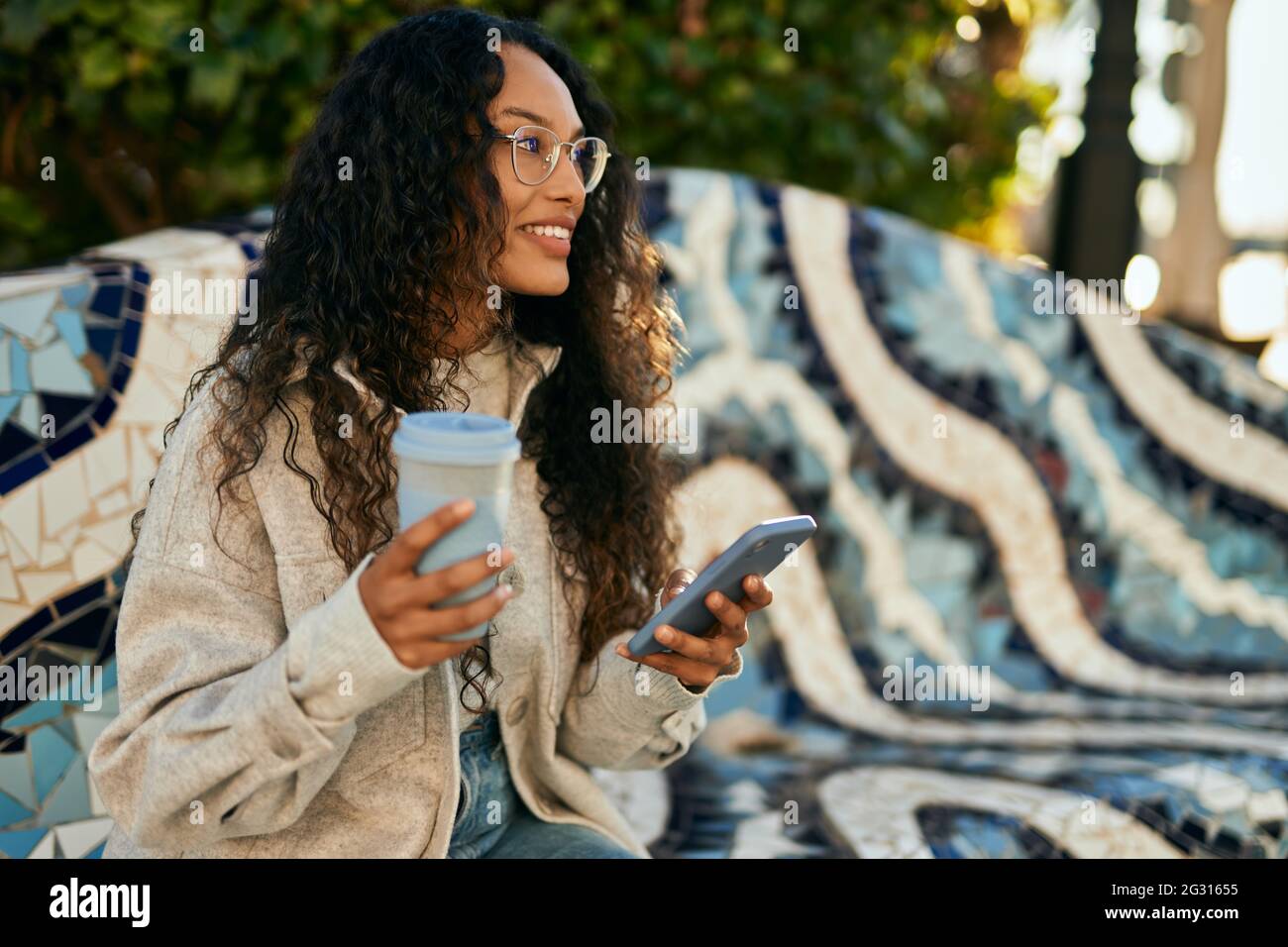 Young nerd woman texting on the phone hi-res stock photography and ...