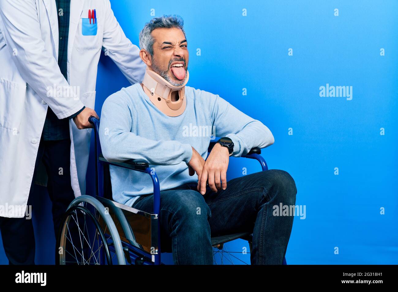 Handsome middle age man with grey hair on wheelchair wearing cervical ...