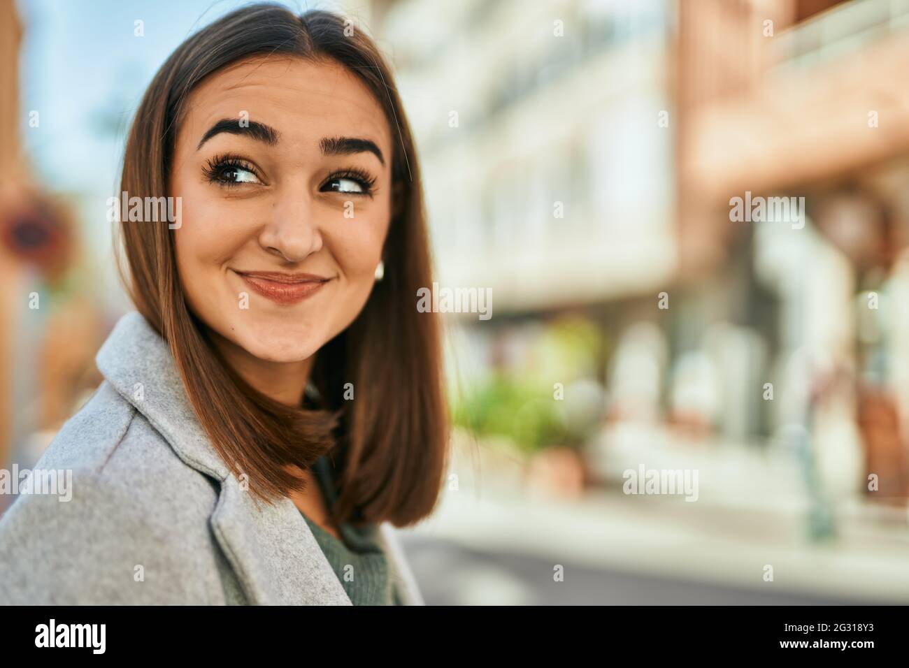 Young hispanic girl smiling happy standing at the city Stock Photo - Alamy