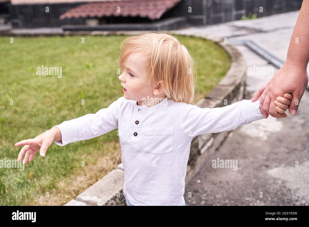 Mother hold sun hand. Outdoor family lifestyle Stock Photo - Alamy