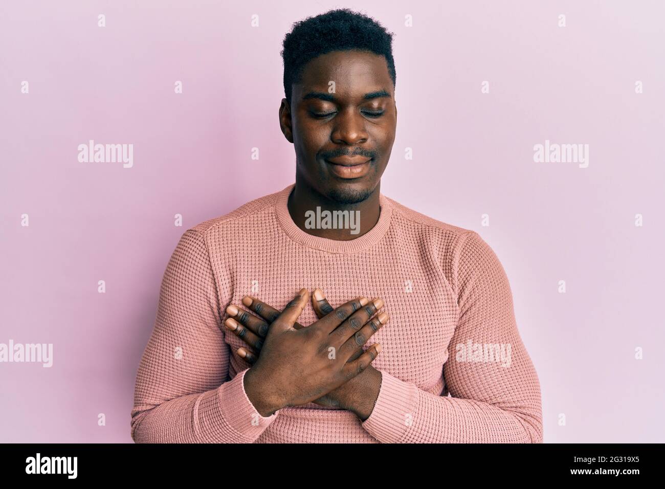 Handsome black man wearing casual clothes smiling with hands on chest ...