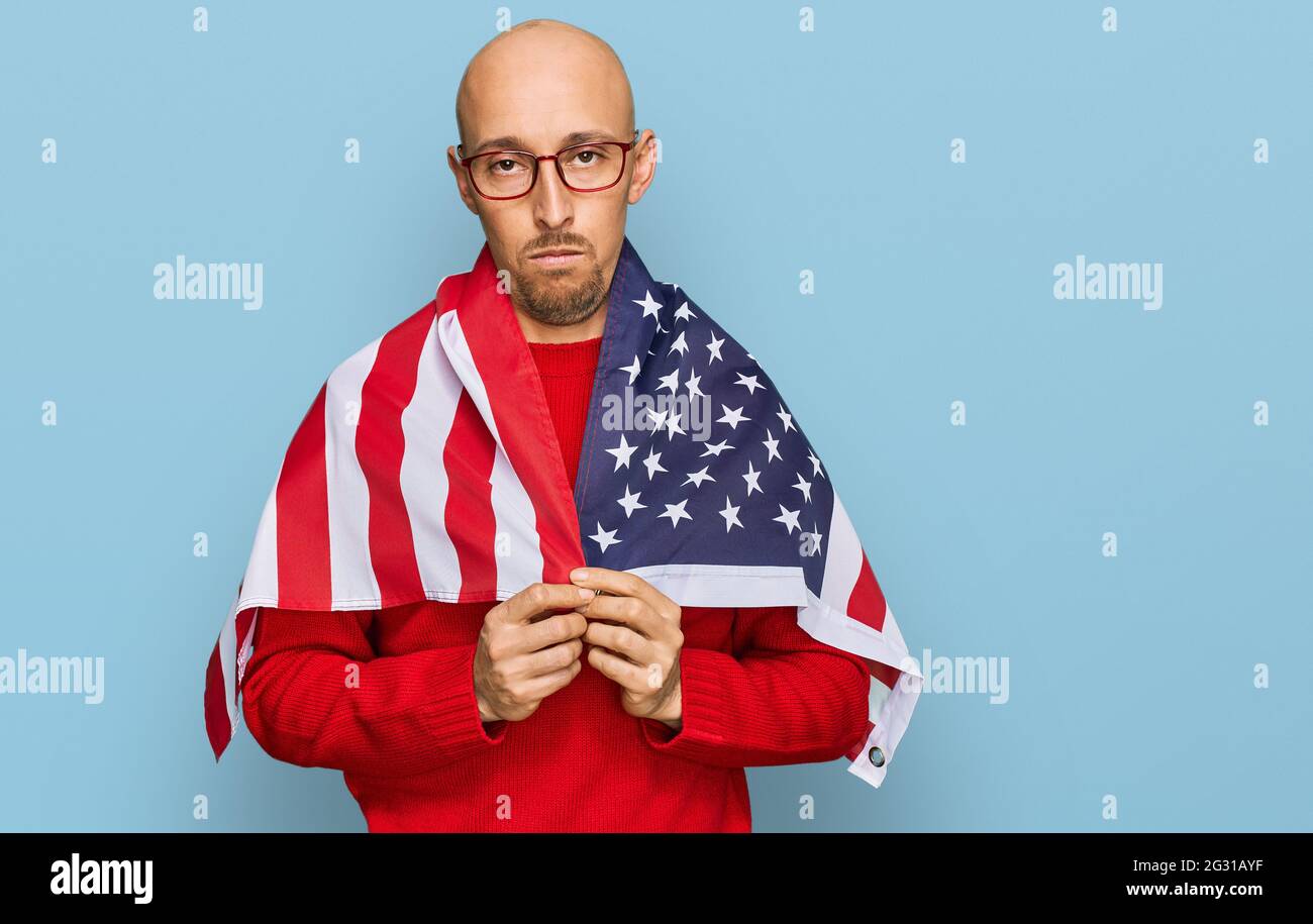 Bald man with beard wrapped around united states flag thinking attitude ...
