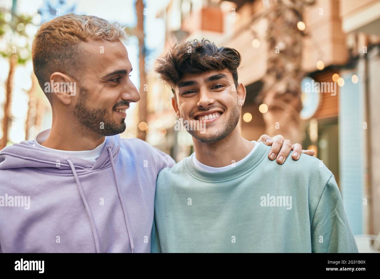 Young gay couple smiling happy and hugging at the city Stock Photo - Alamy