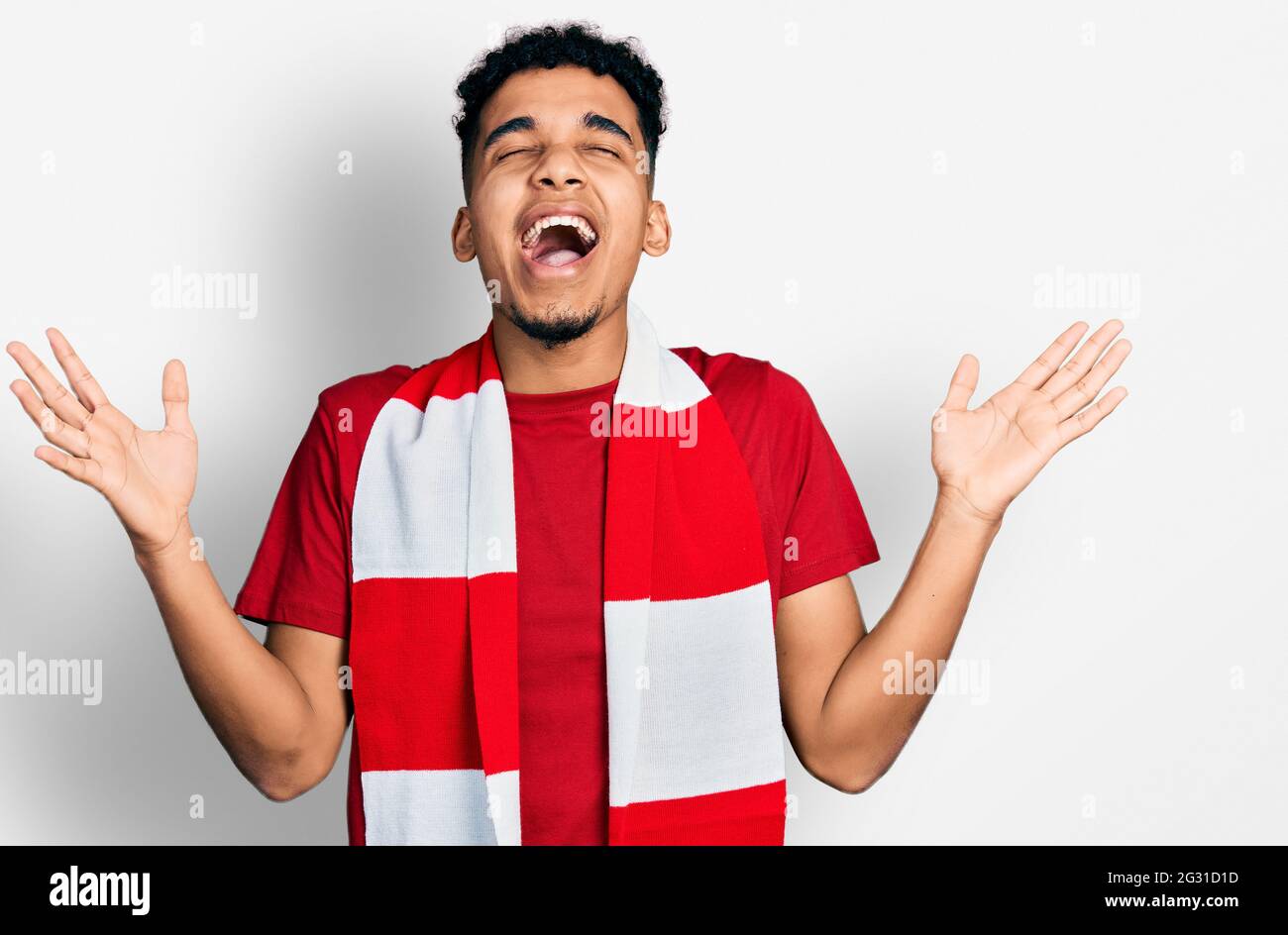 Young african american man football hooligan cheering game celebrating ...