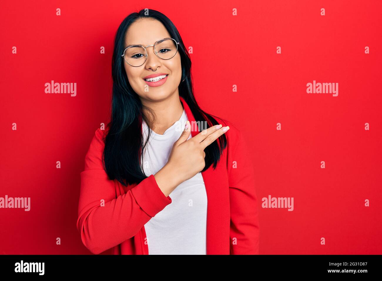 Beautiful hispanic woman with nose piercing wearing casual look and ...