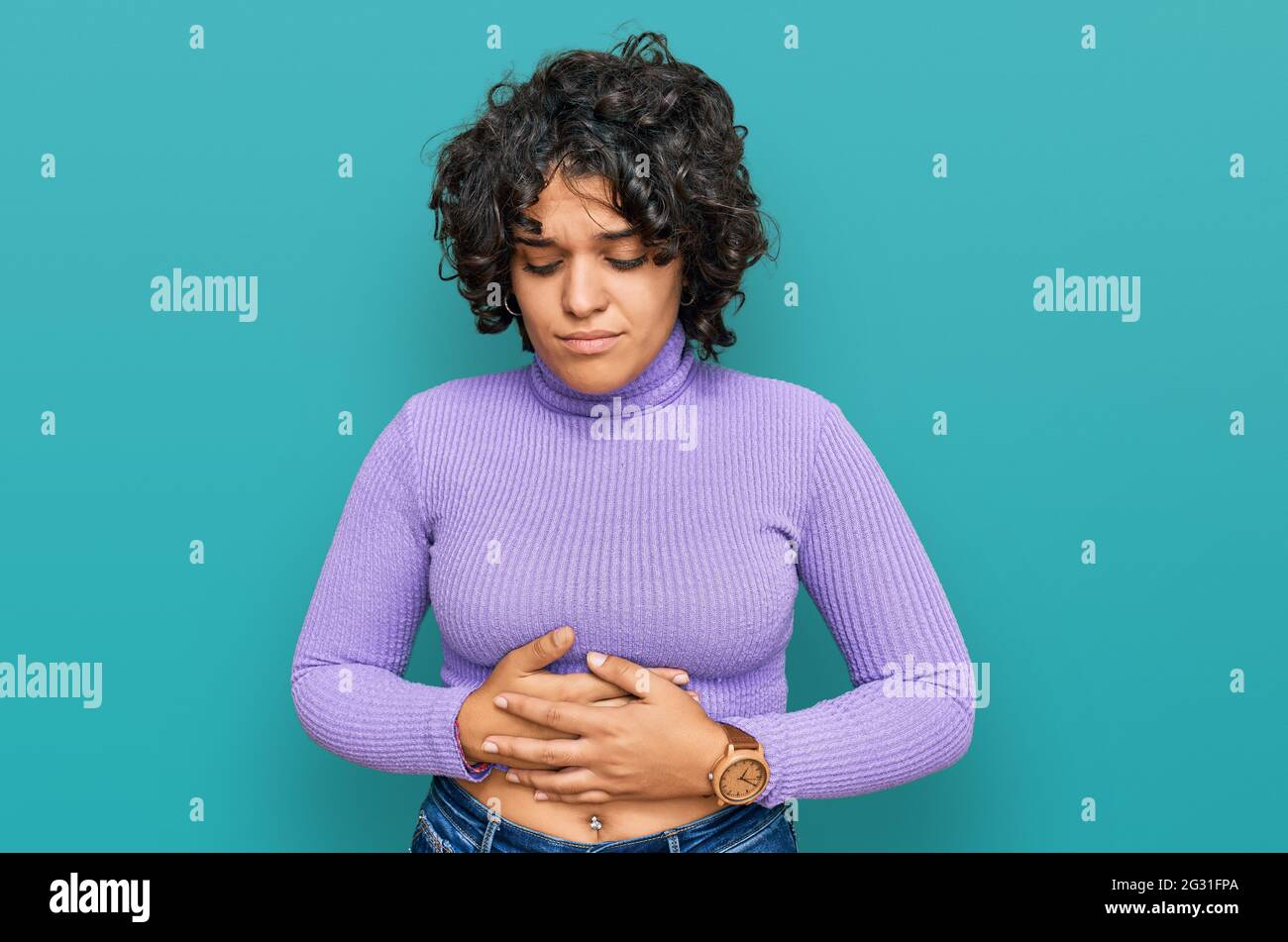 Young hispanic woman with curly hair wearing casual clothes with hand ...