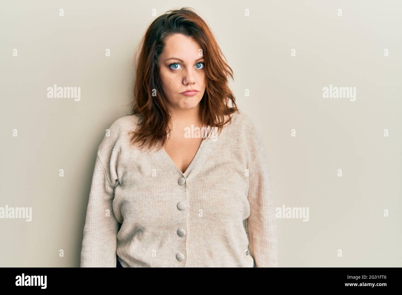 Young caucasian woman wearing casual clothes depressed and worry for ...