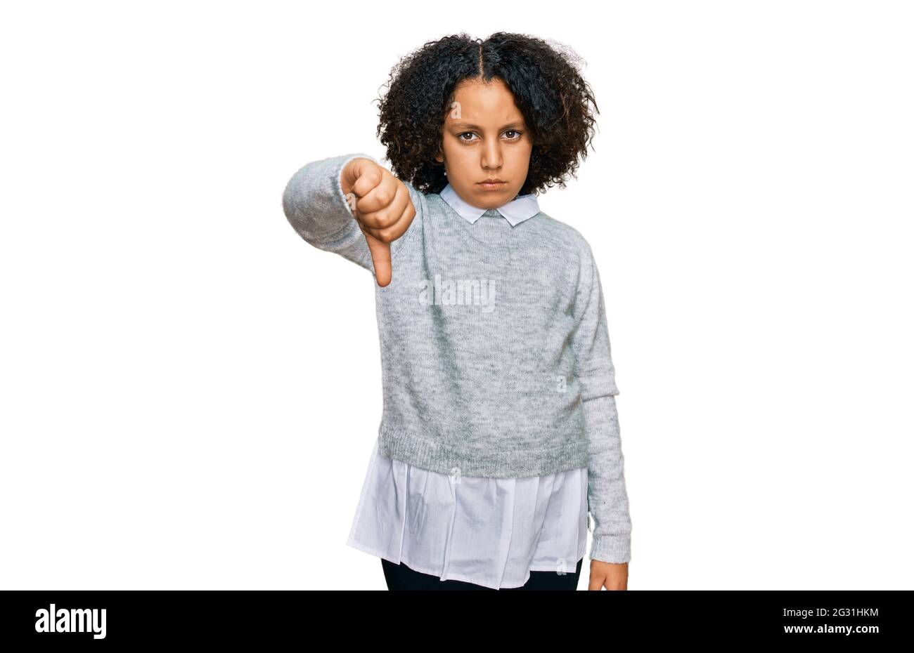 Young little girl with afro hair wearing casual clothes looking unhappy ...