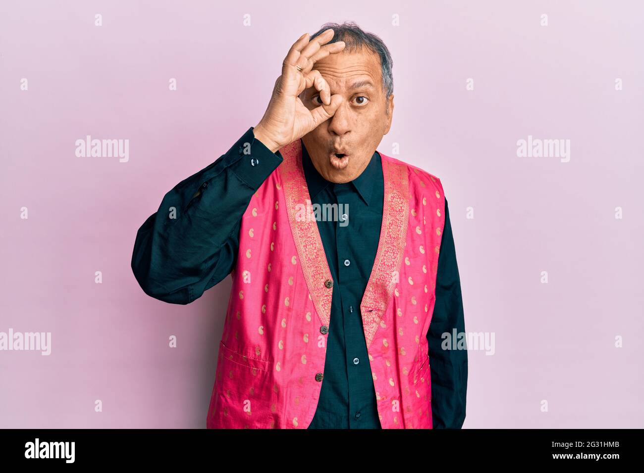 Middle age indian man wearing traditional indian clothes doing ok ...