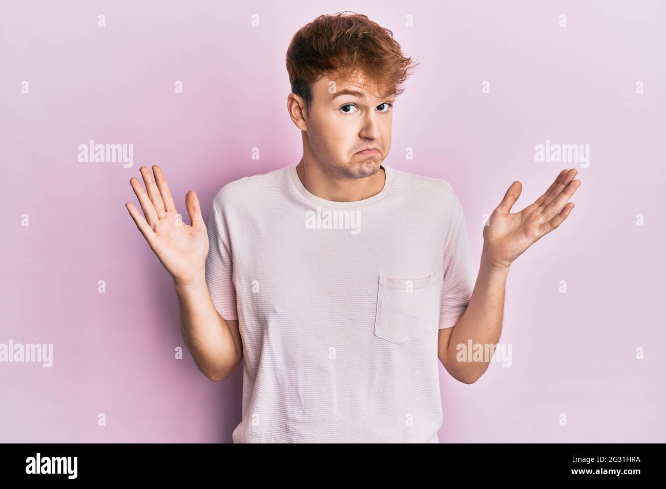 Young caucasian man wearing casual t shirt clueless and confused with ...