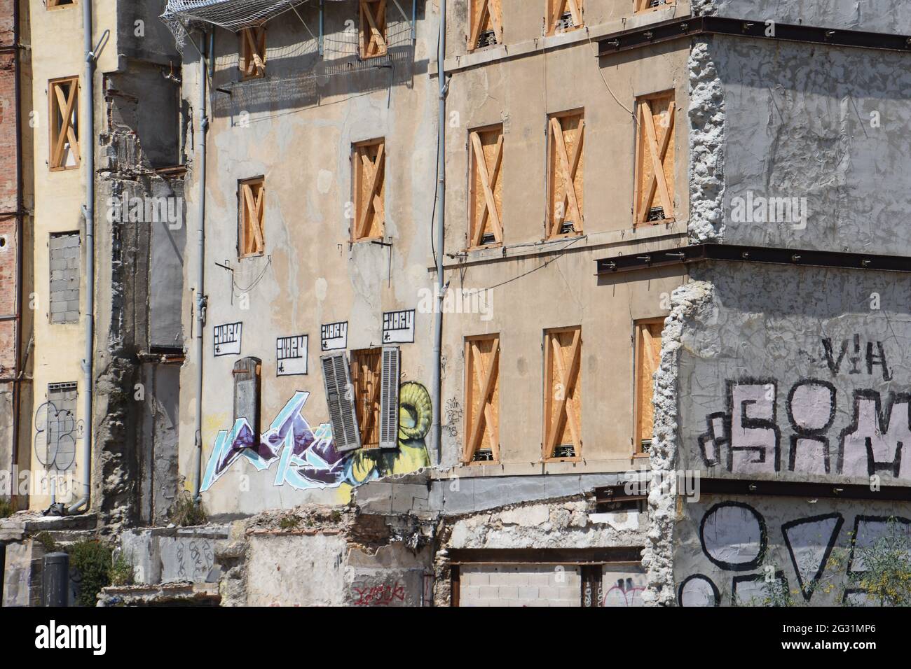 Remains of a building and facade of a dilapidated building.Dilapidated buildings “rue de la ...