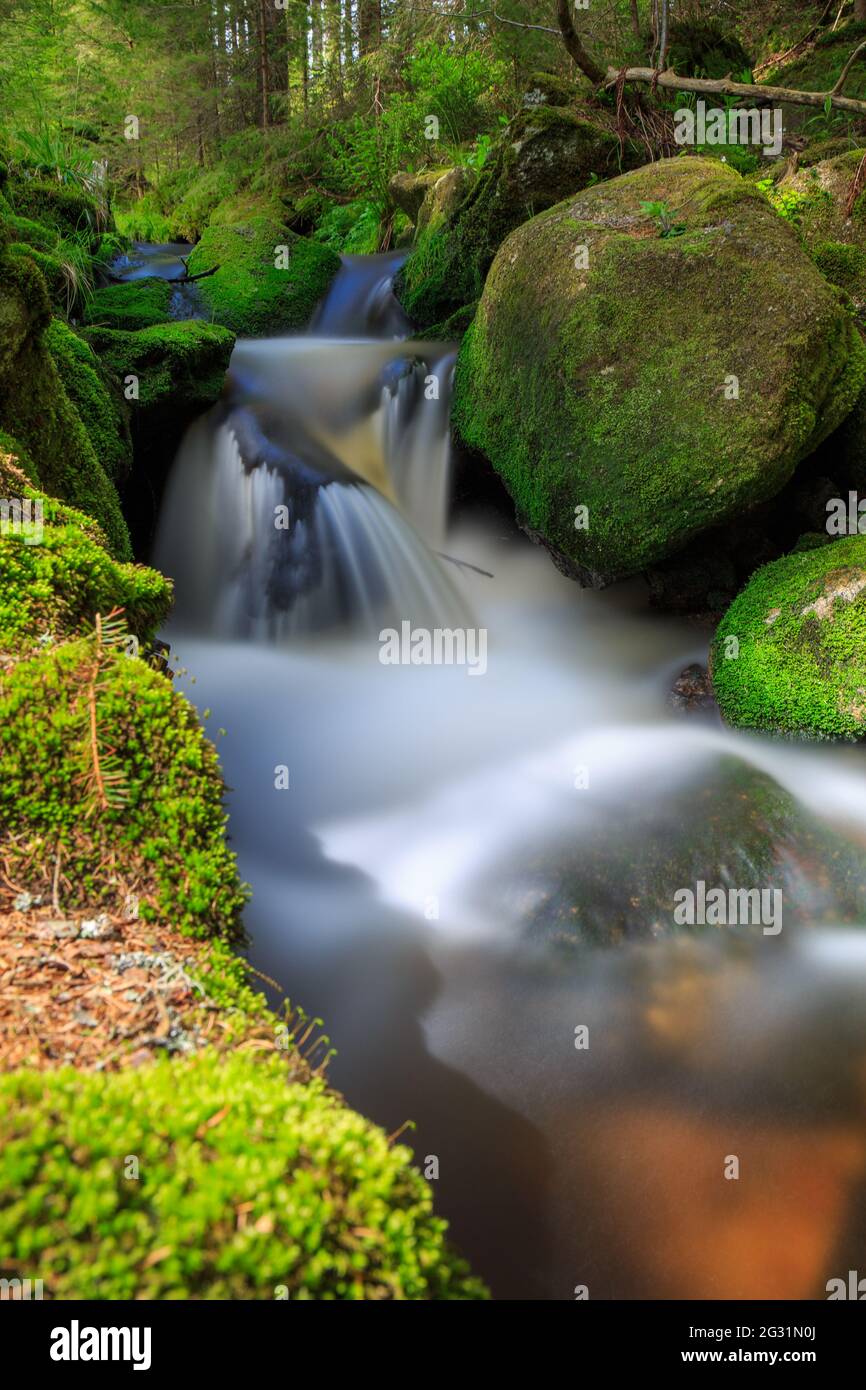 Beautiful waterfall with smooth water. This image has a flim grain ...