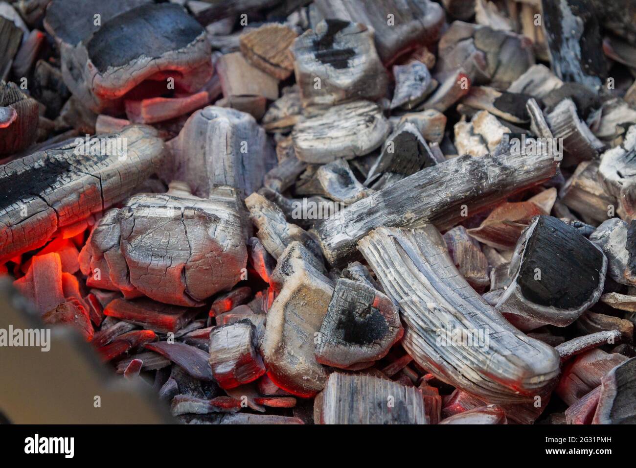 Red-hot coals lie in the barbecue grill in the spring Stock Photo - Alamy