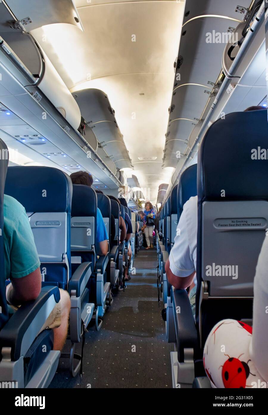 Looking down the aisle of a passenger plane Stock Photo - Alamy