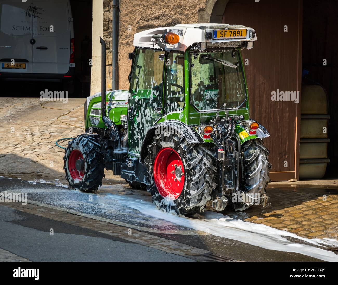 Foam wash for a tractor in Ahn, Luxembourg Stock Photo - Alamy