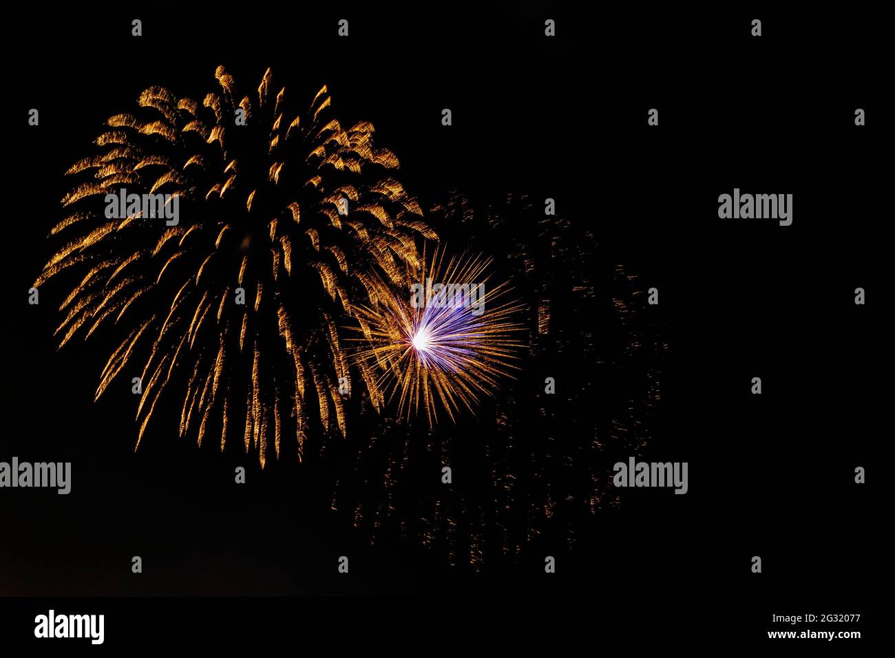 Dark sky with colorful firework blast Stock Photo - Alamy