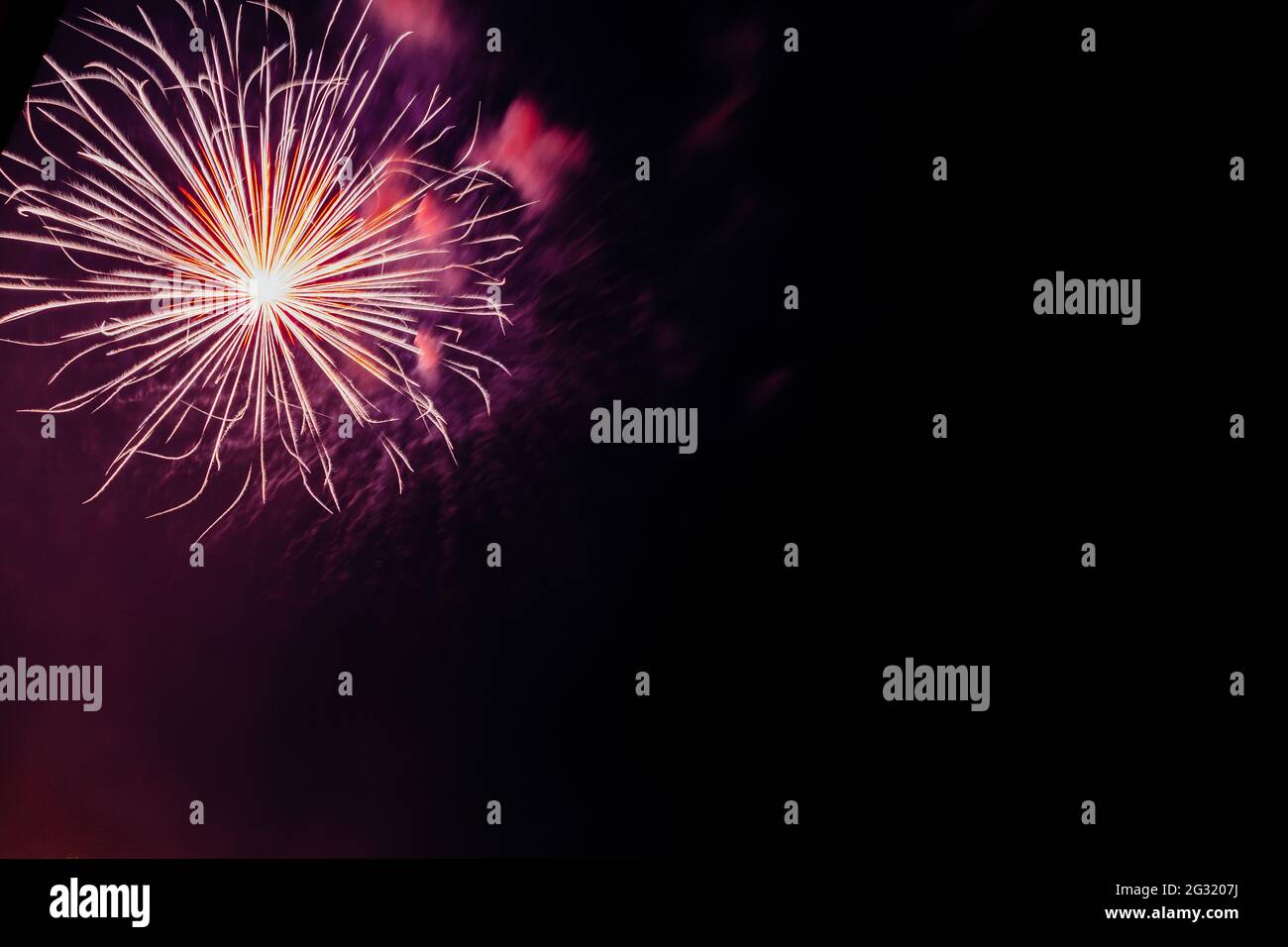 Dark sky with colorful firework blast Stock Photo - Alamy