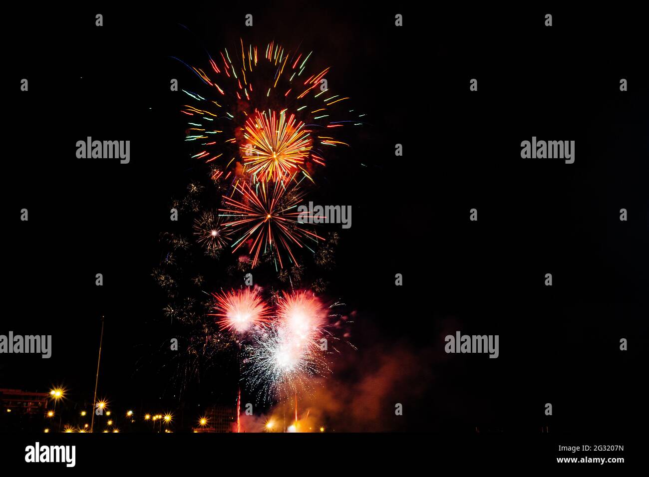 Dark sky with colorful firework blast Stock Photo - Alamy