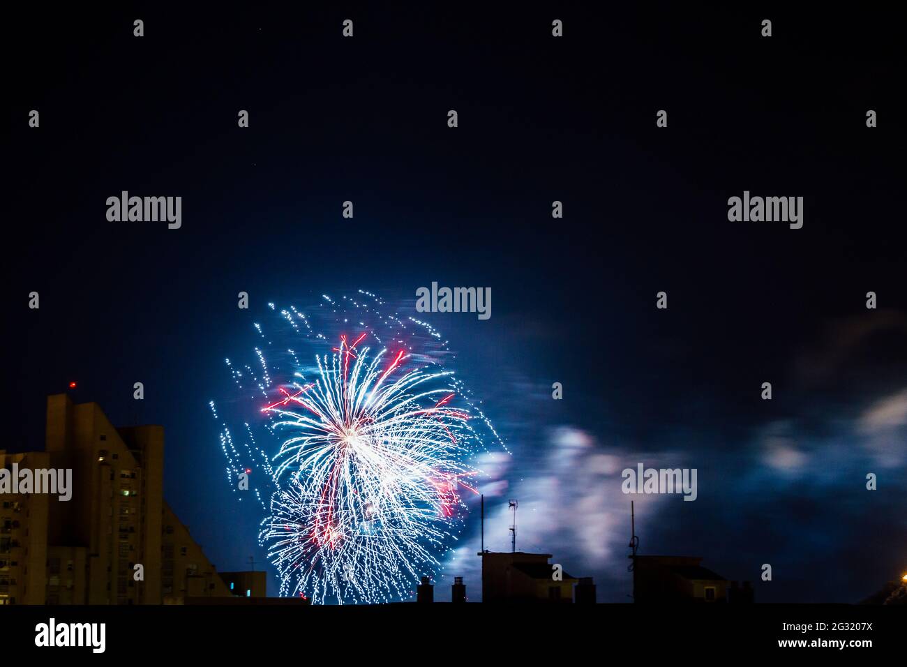 Dark sky with colorful firework blast Stock Photo - Alamy