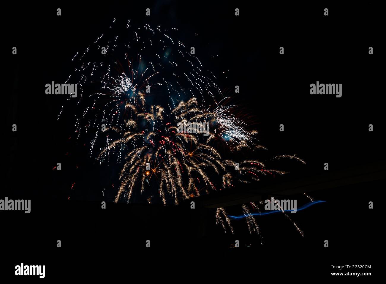 Dark sky with colorful firework blast Stock Photo - Alamy