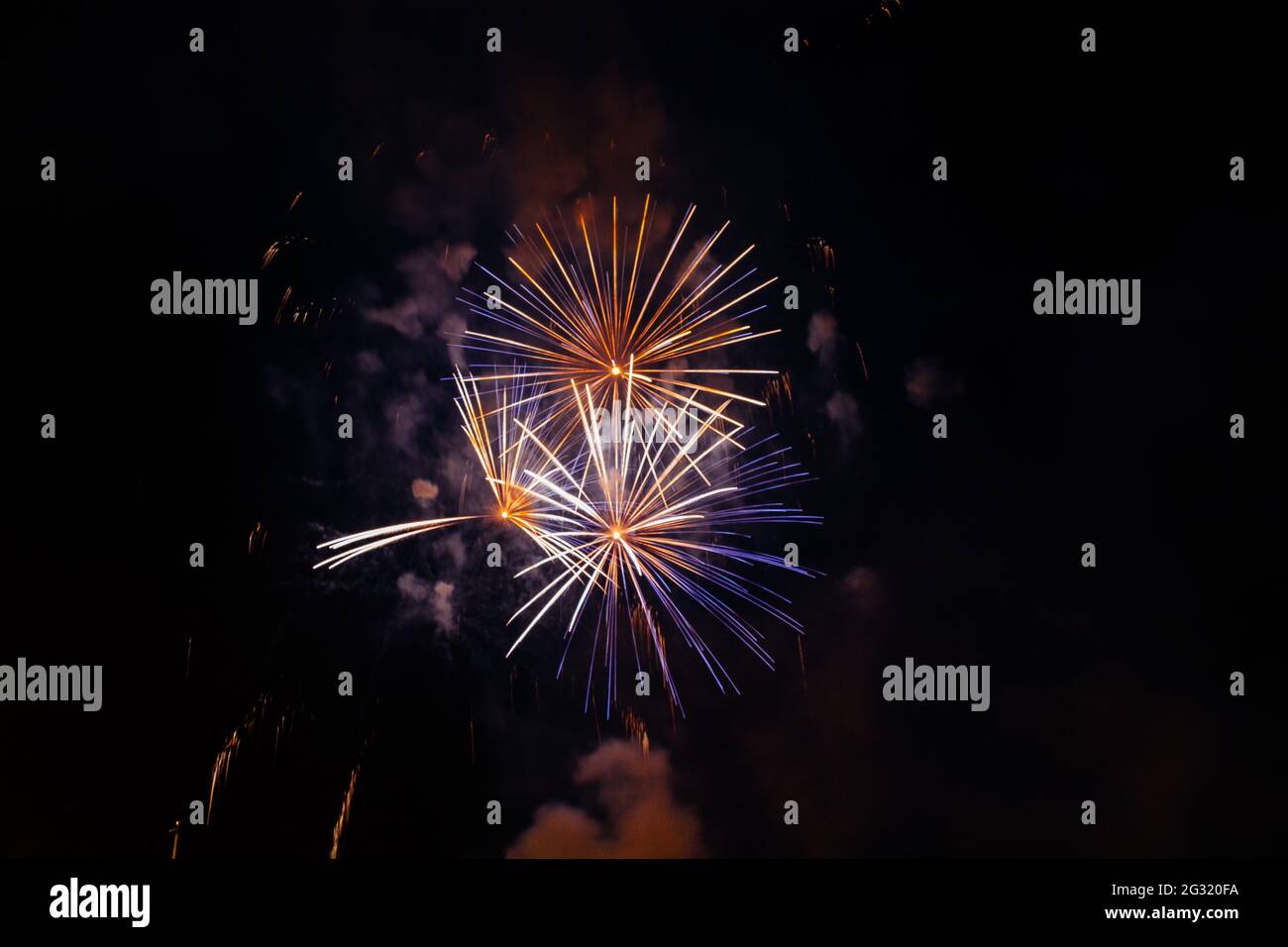 Dark sky with colorful firework blast Stock Photo - Alamy
