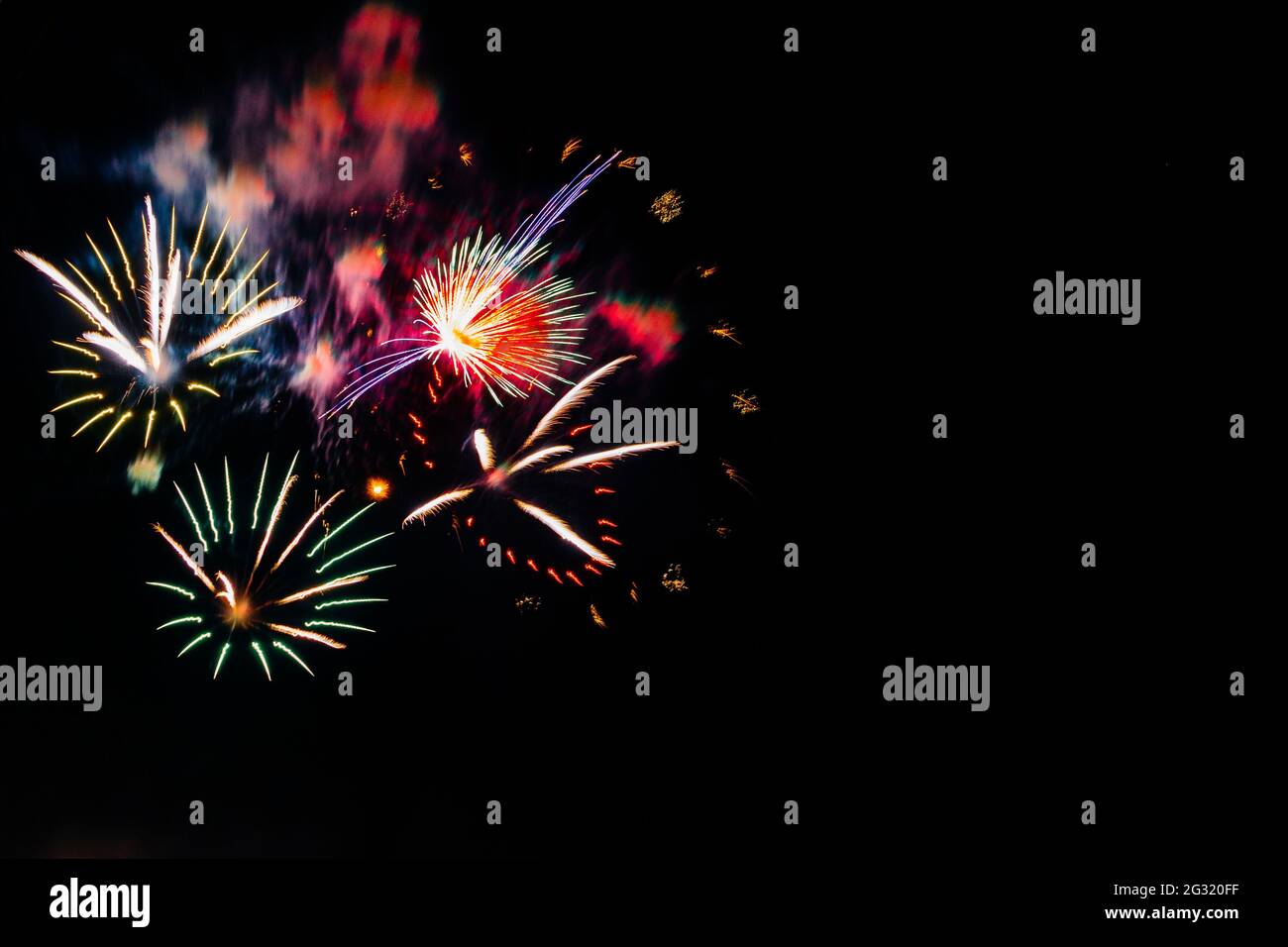 Dark sky with colorful firework blast Stock Photo - Alamy