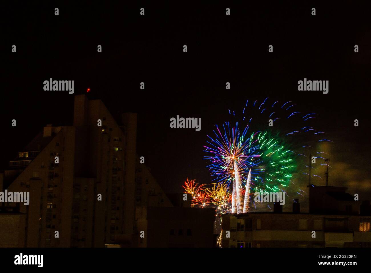 Dark sky with colorful firework blast Stock Photo - Alamy