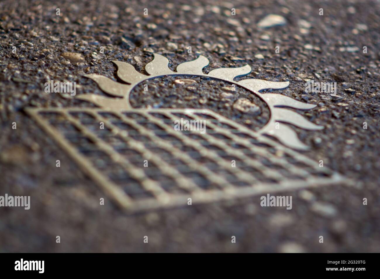 A closeup shot of cast iron pavement on a rough surface Stock Photo - Alamy
