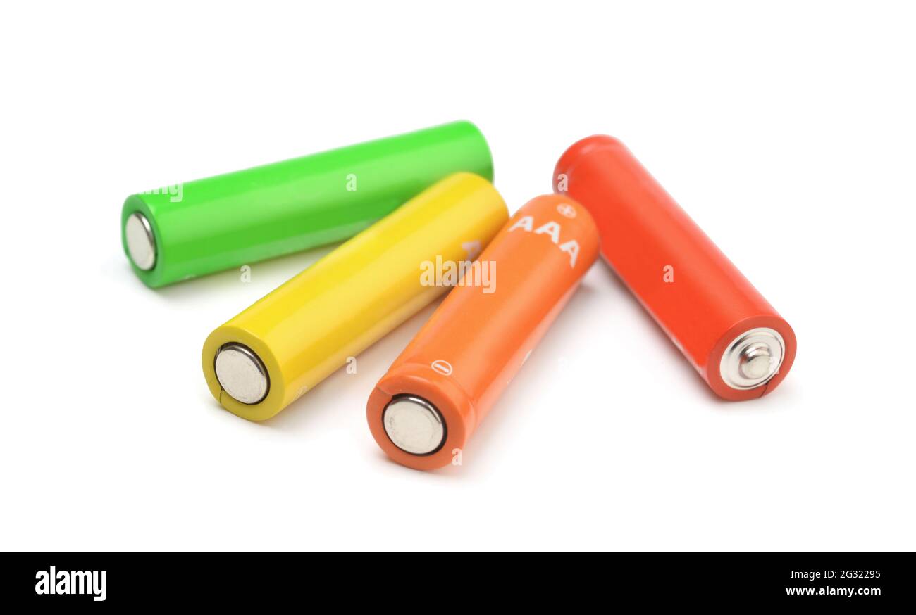Several multi-colored batteries isolated on white Stock Photo - Alamy
