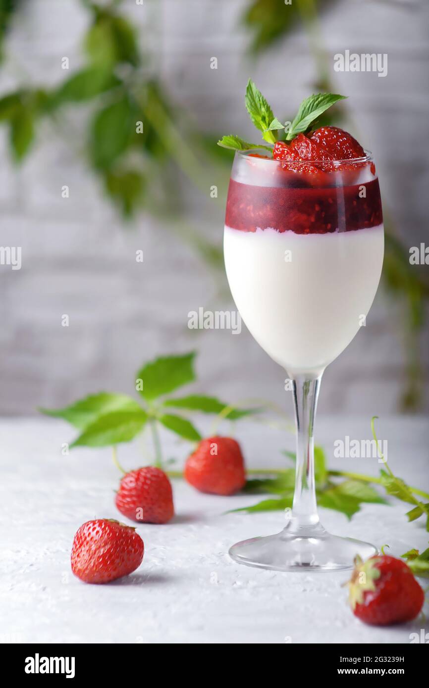 Traditional Italian dessert vanilla strawberry panna cotta in verina ...