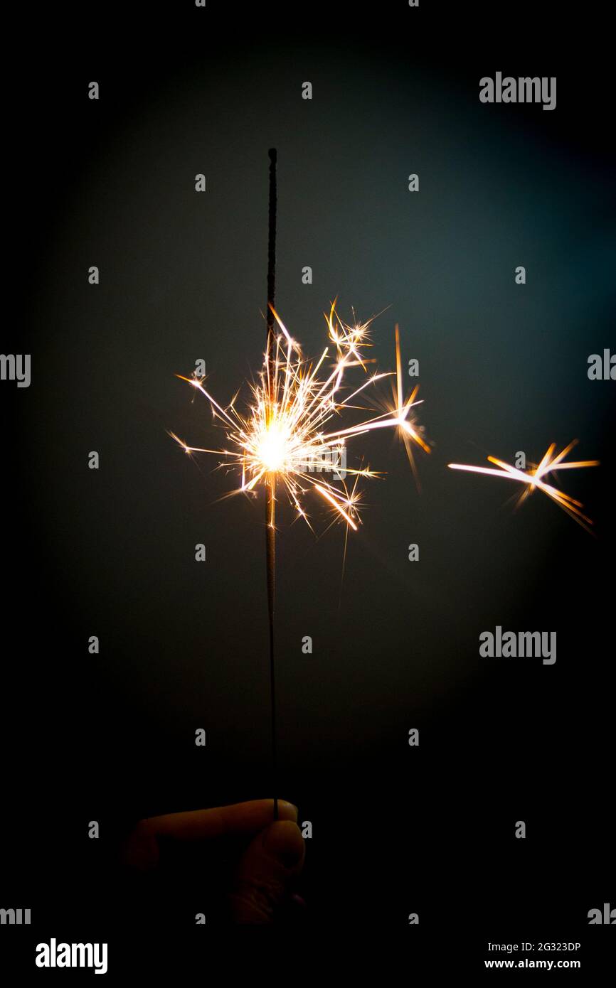 Burning Bengali fire on a dark background, make a wish for the new year ...